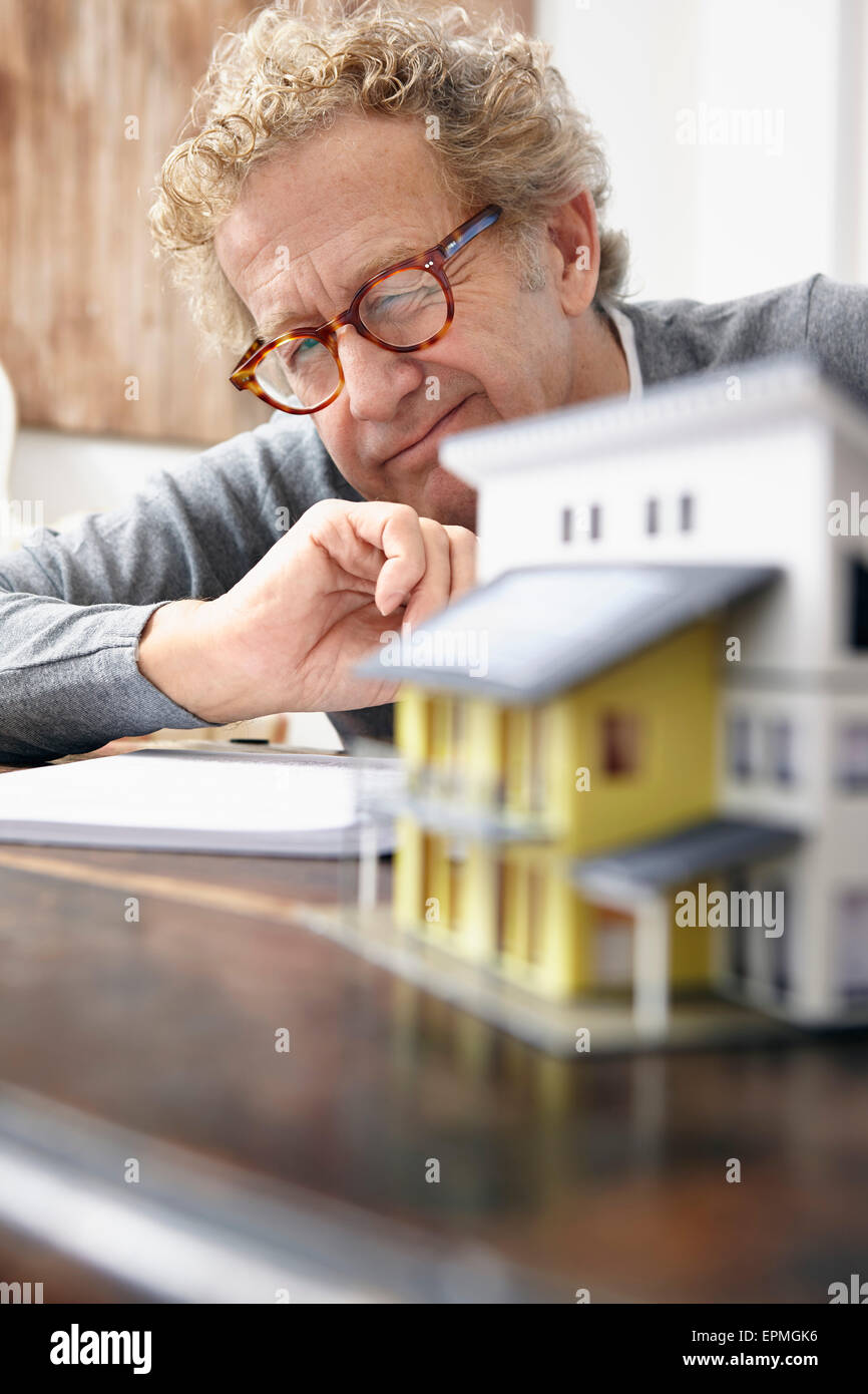Senior man planning residential building Stock Photo - Alamy