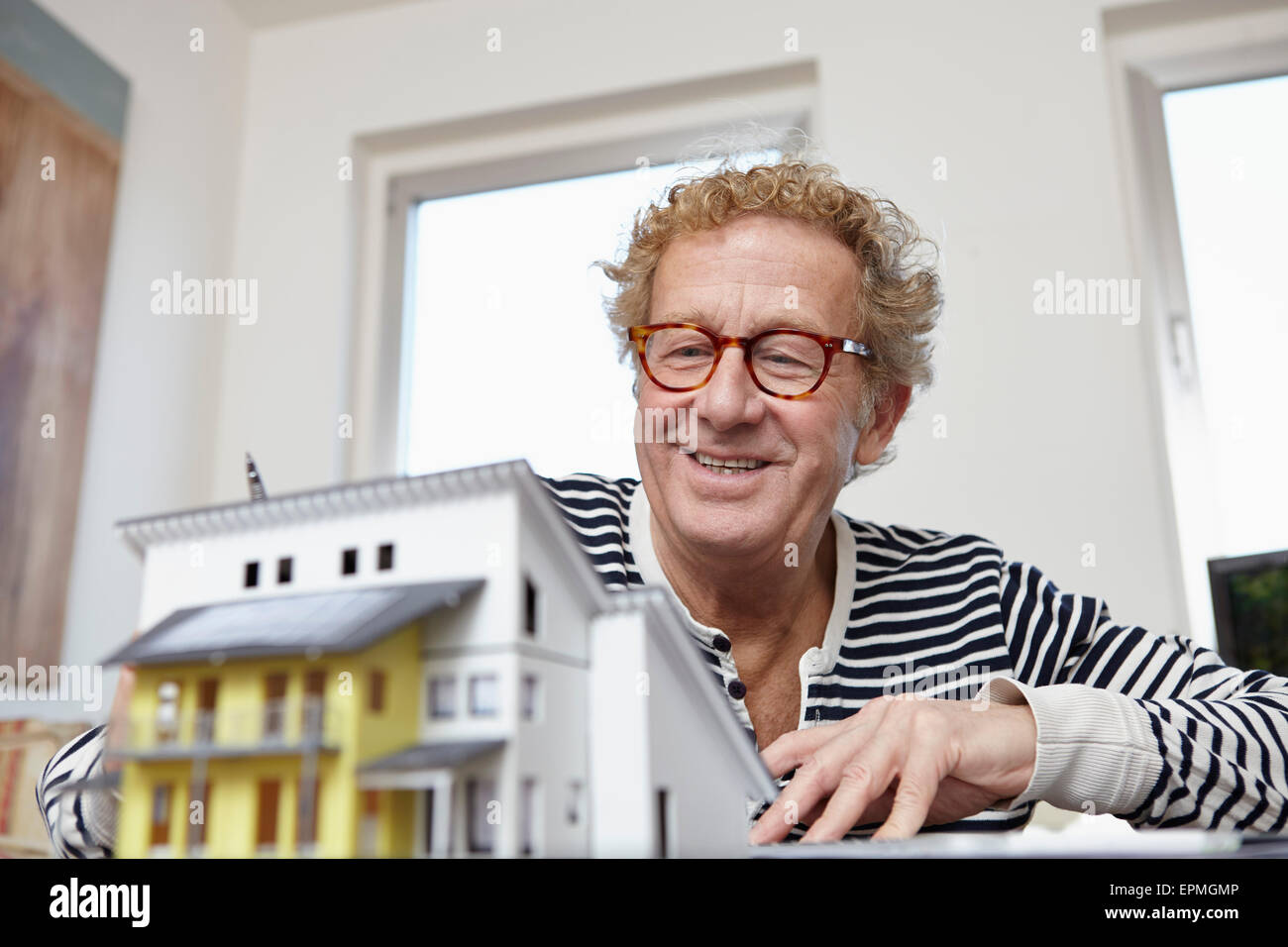Senior man planning residential building Stock Photo - Alamy