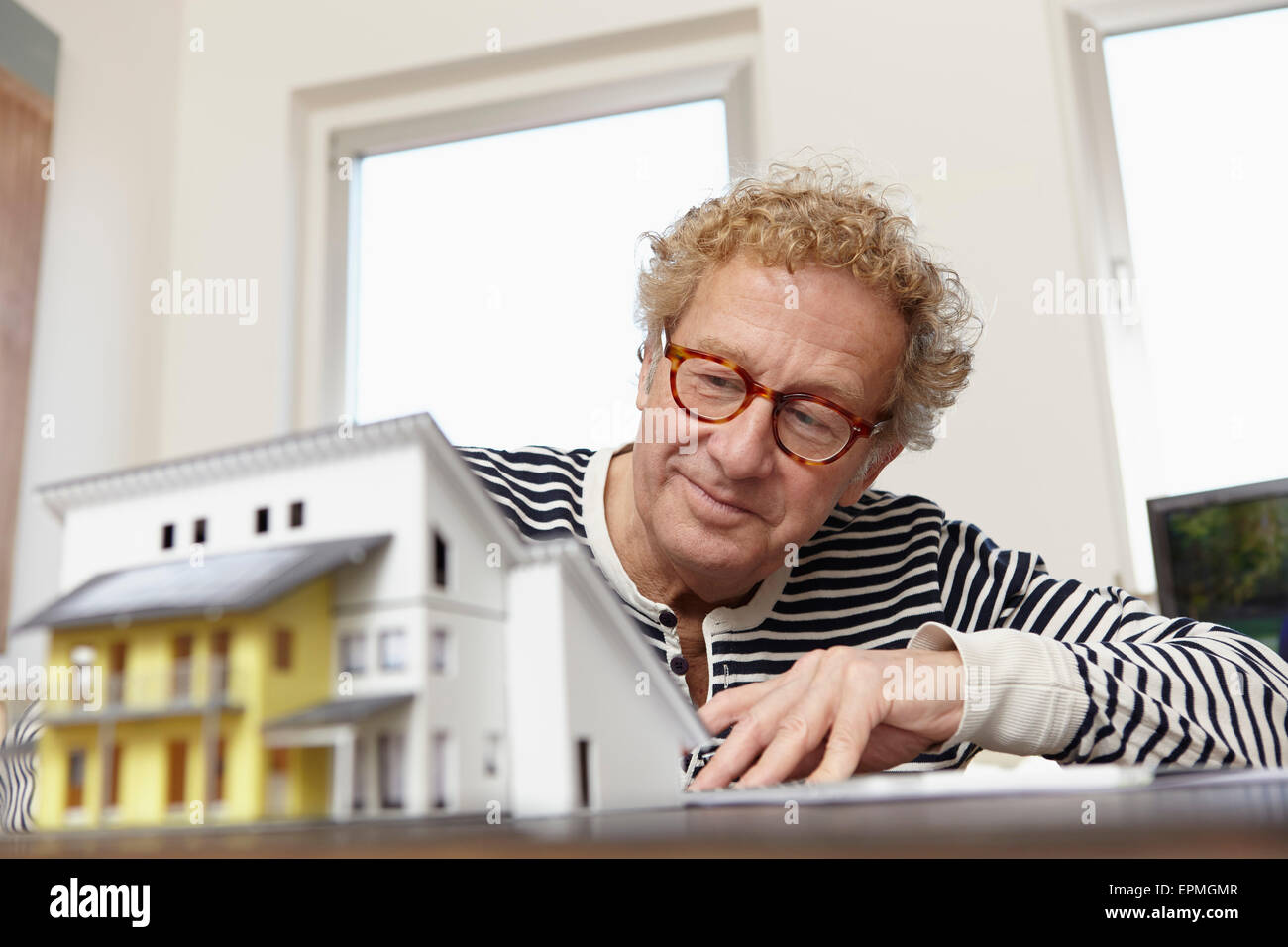 Senior man planning residential building Stock Photo - Alamy