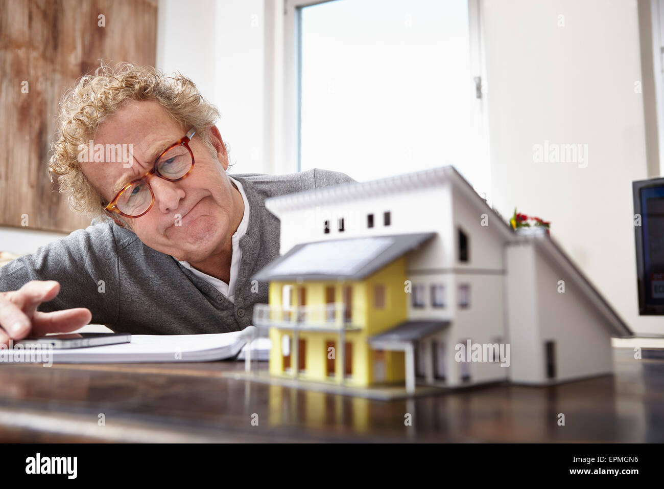 Senior man planning residential building Stock Photo - Alamy