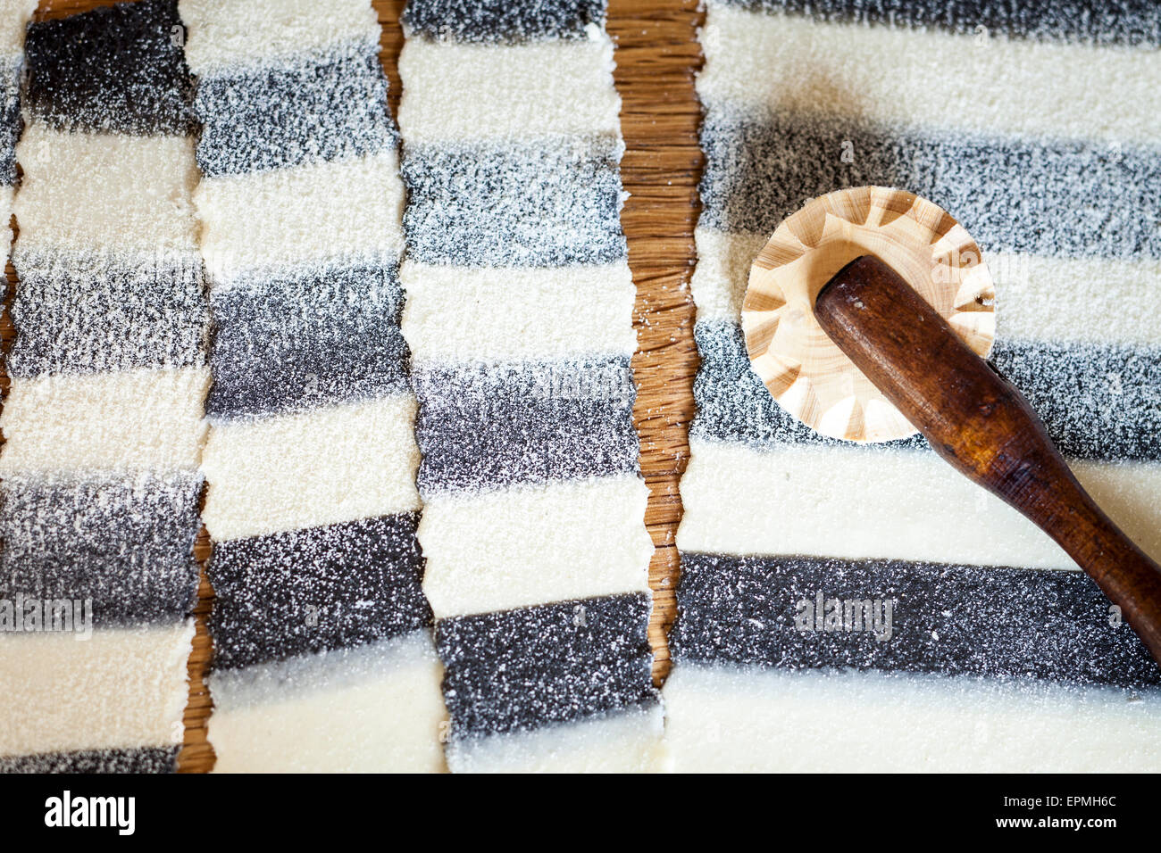Homemade striped pasta, partly colored with cuttlefish ink Stock Photo ...