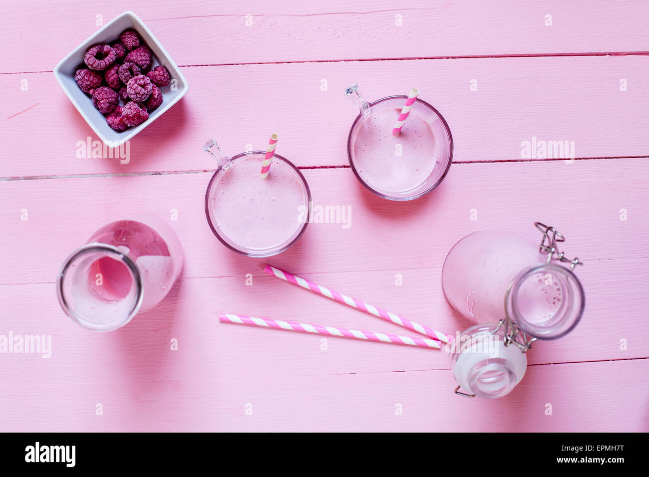 Raspberry smoothie on pink ground Stock Photo - Alamy