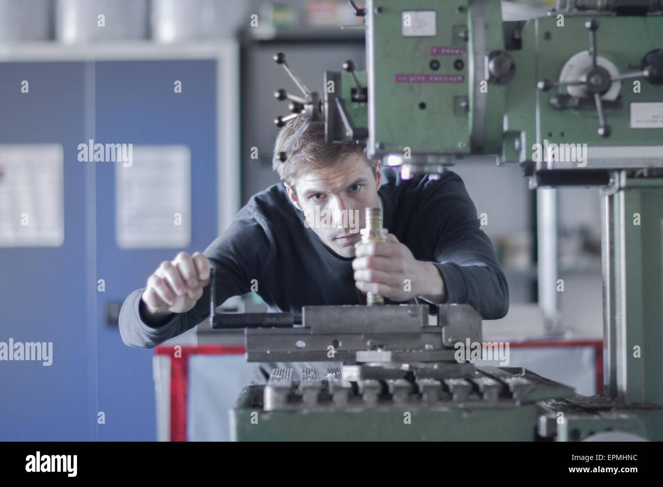Technician working at a lathe Stock Photo - Alamy