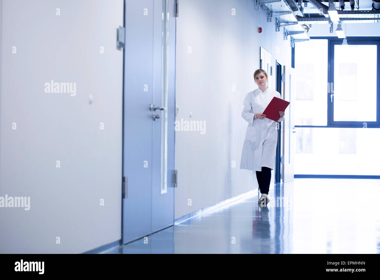 Laboratory woman walking hi-res stock photography and images - Alamy