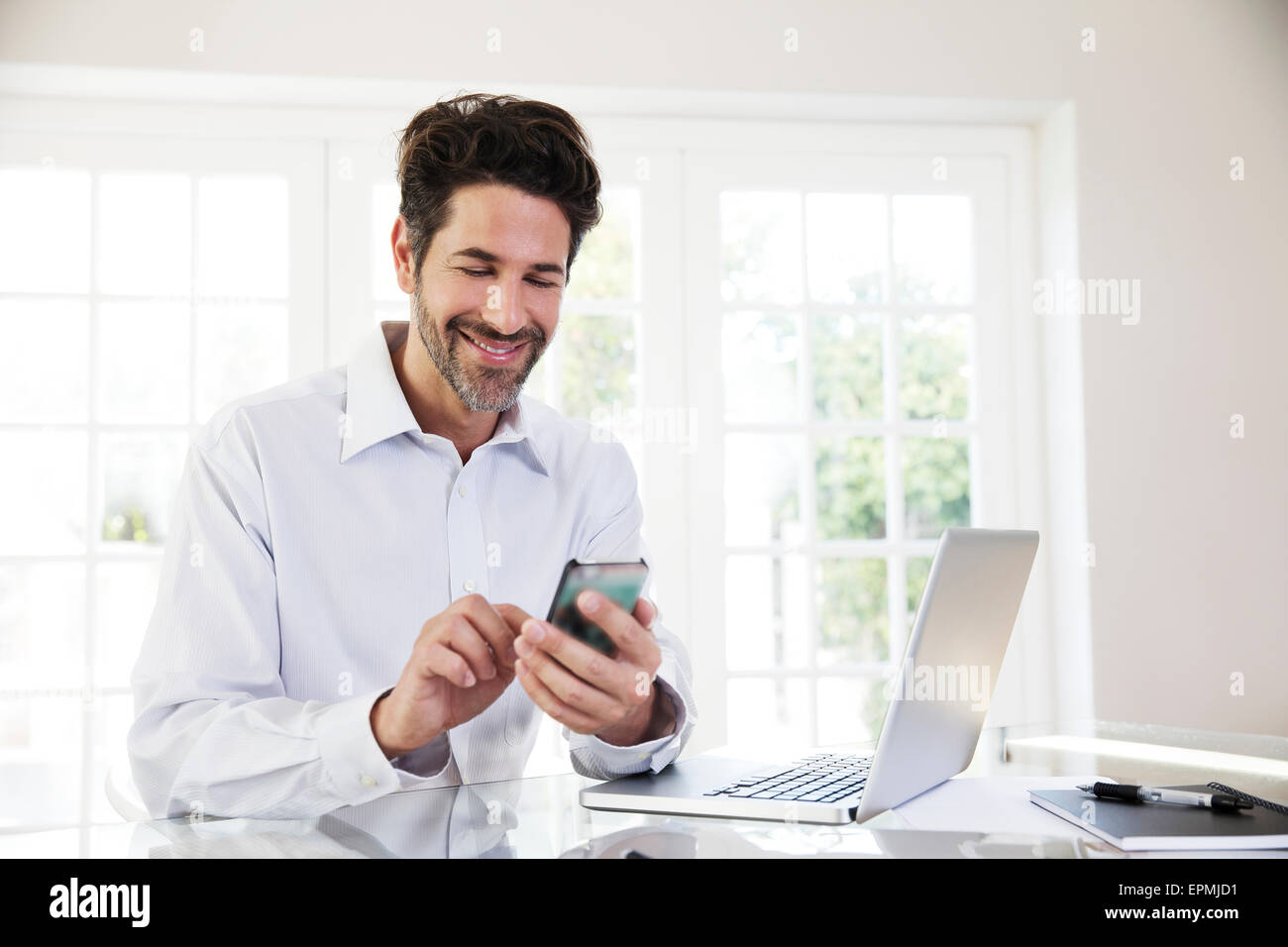 Mature man working from home Stock Photo - Alamy