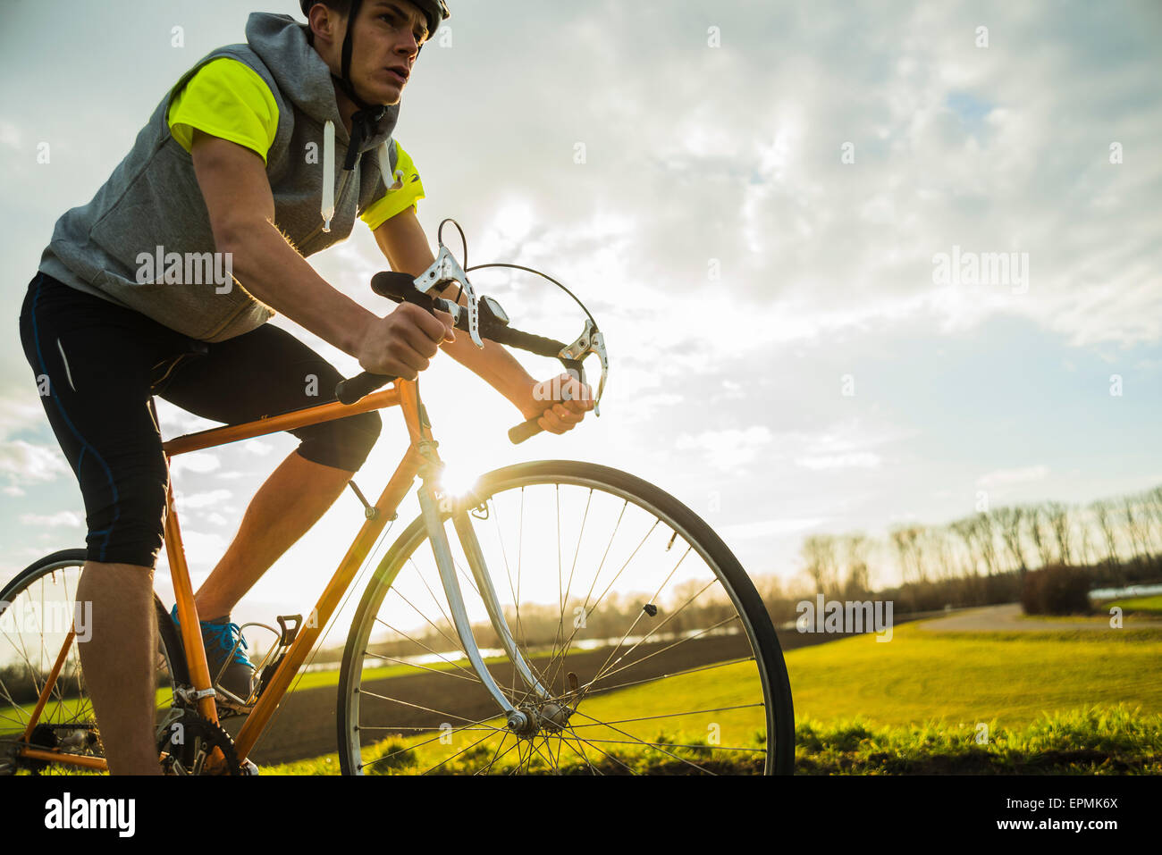 Germany, Mannheim, young man riding bicycle Stock Photo - Alamy