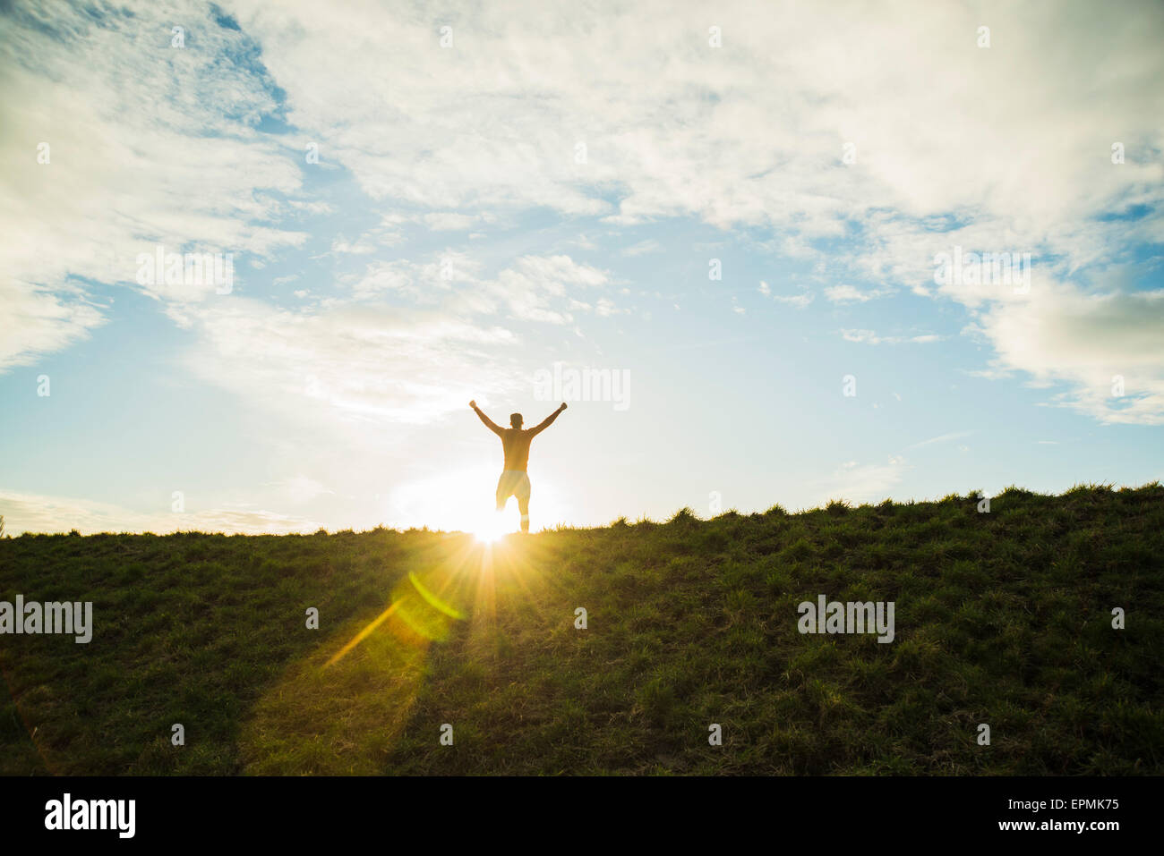 Young man looking at rising sun hi-res stock photography and images - Alamy