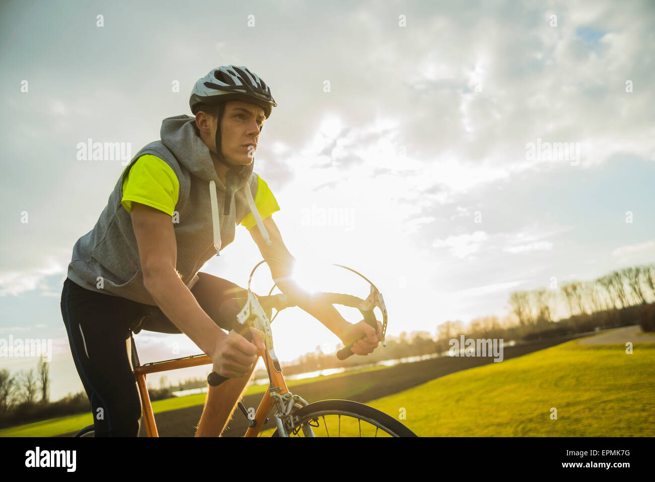 Germany, Mannheim, young man riding bicycle Stock Photo - Alamy