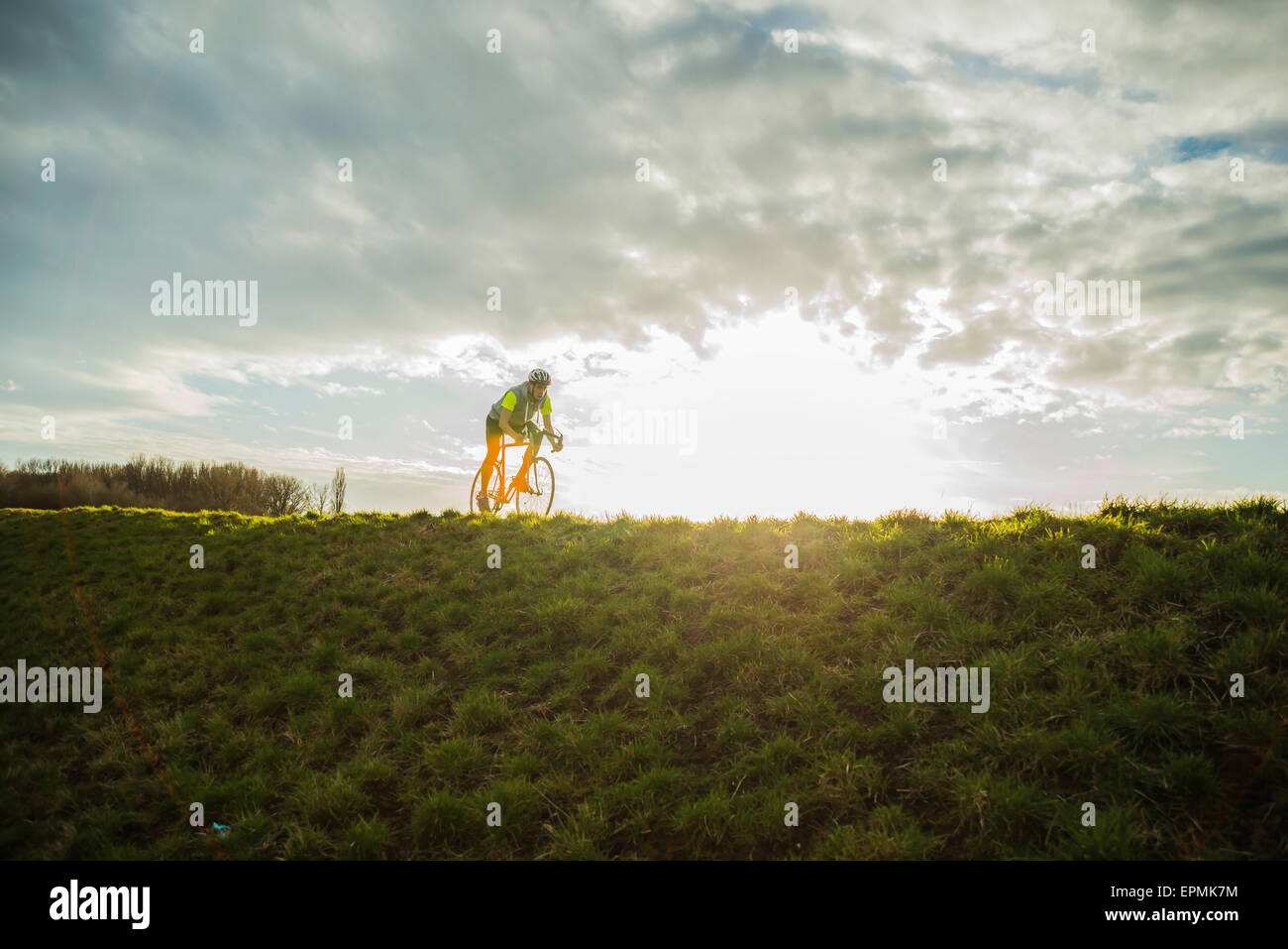 Distant cyclist riding bicycle hi-res stock photography and images - Alamy