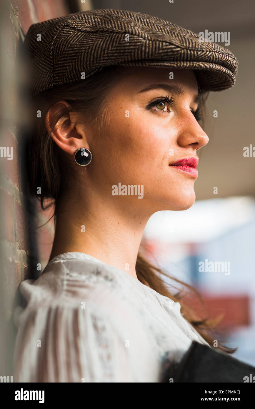 Young woman wearing cap outdoors Stock Photo - Alamy