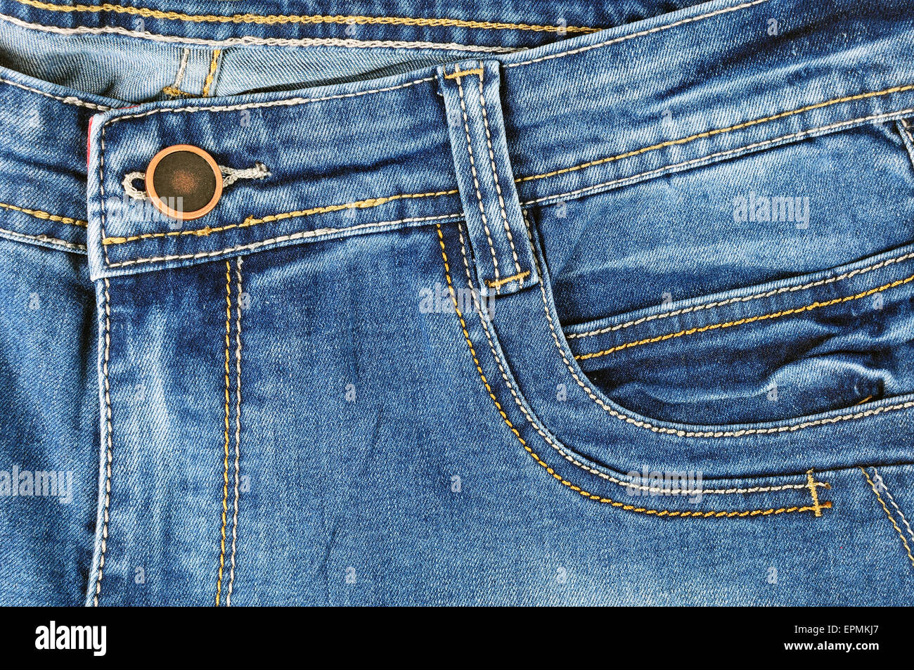 Detail of the closure and front pocket of pants in jeans for men light ...
