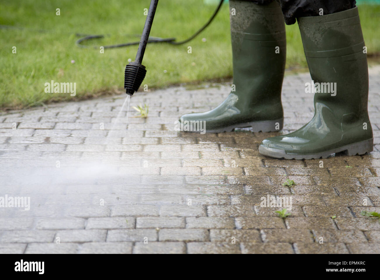 Outdoor floor cleaning with high pressure water jet Stock Photo - Alamy
