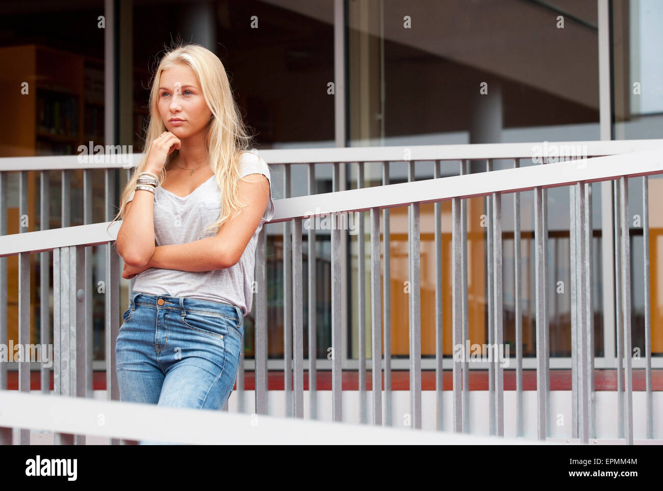 Portrait of waiting blond teenage girl Stock Photo - Alamy