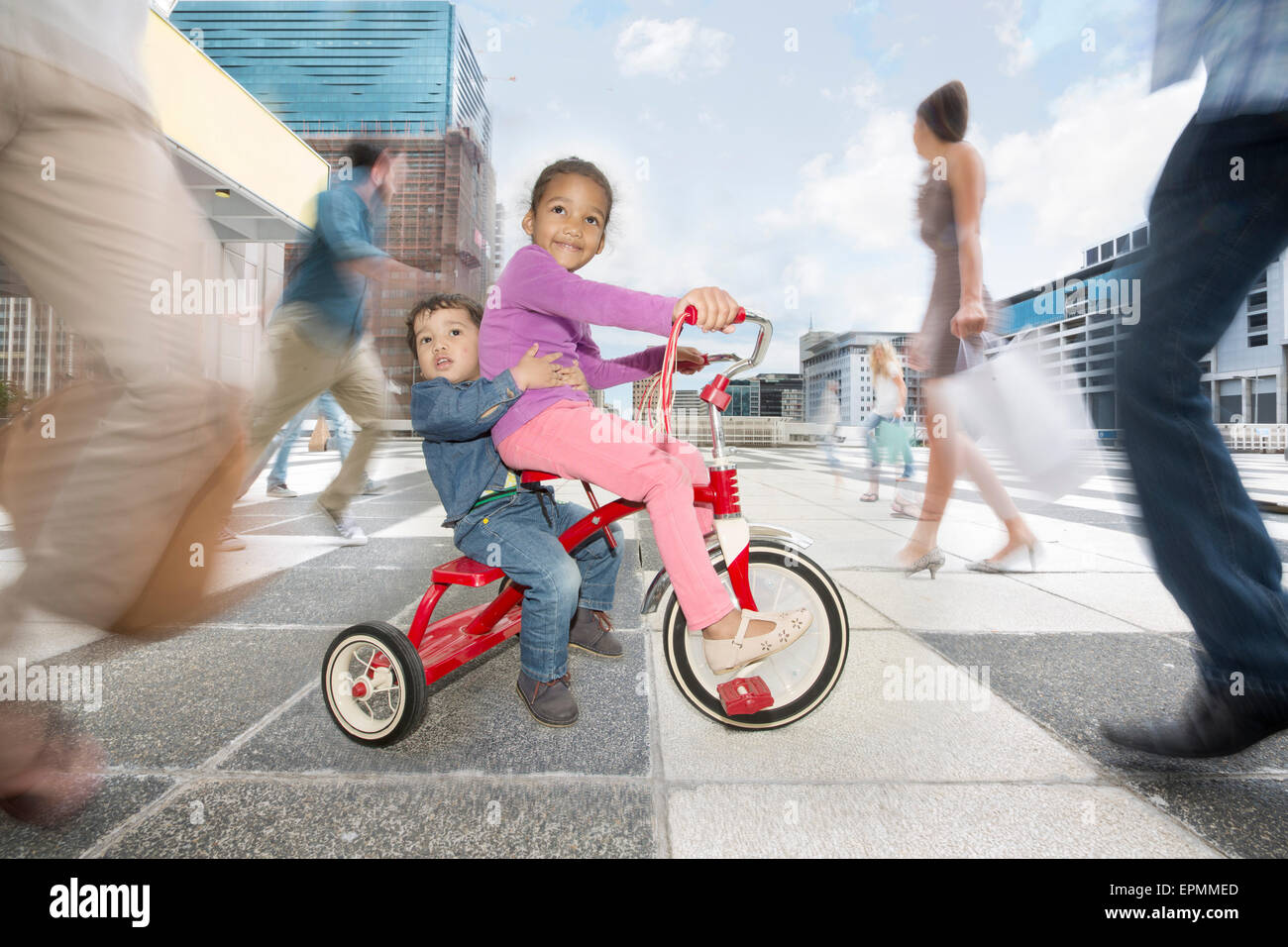 Girl boy riding tricycle between hi-res stock photography and images ...