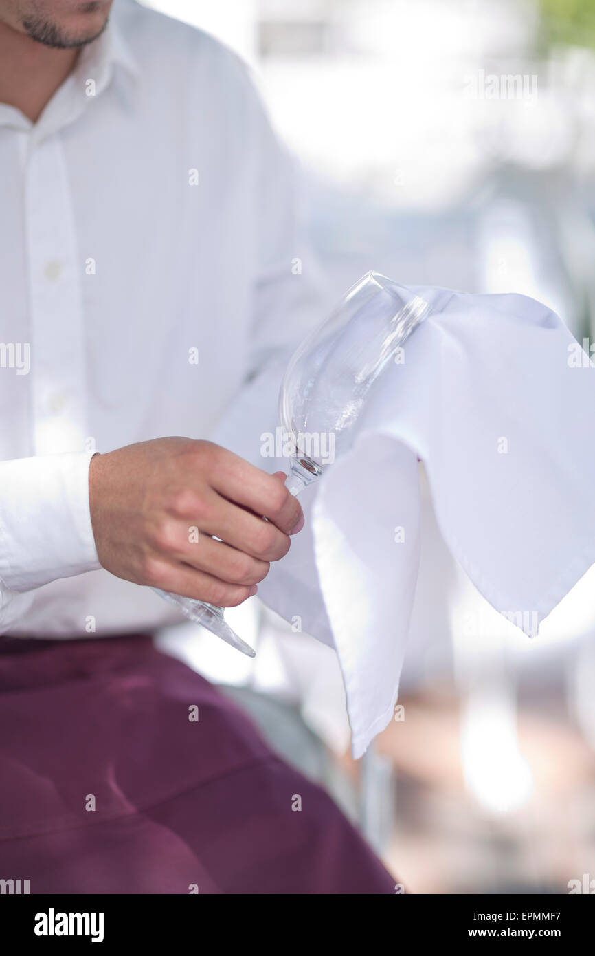 Waiter cleaning wine glass cloth hi-res stock photography and images ...
