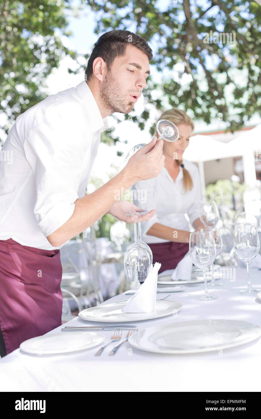 Waiter waitress setting up hi-res stock photography and images - Alamy
