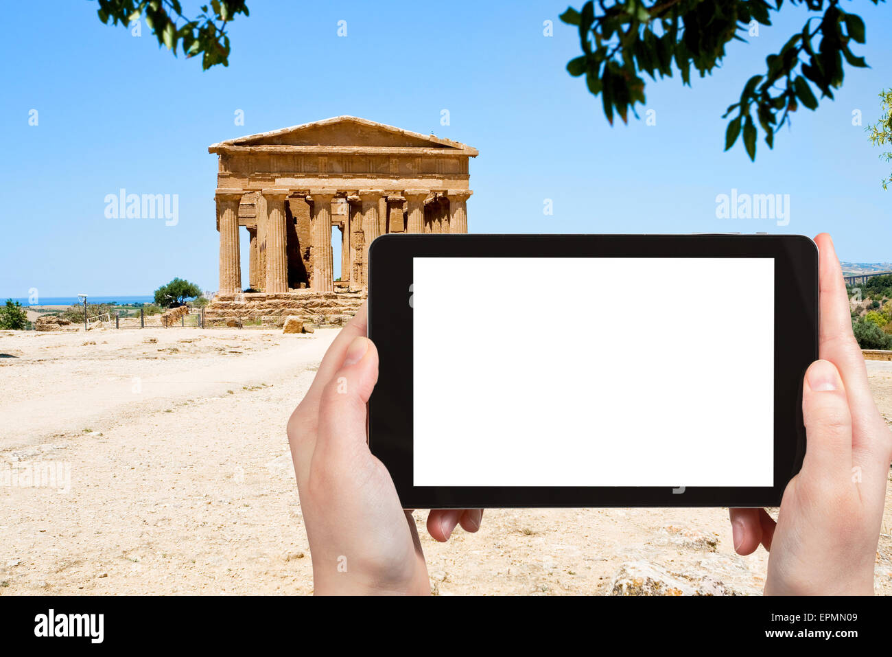 travel concept - tourist photograph ancient Temple of Concordia in ...
