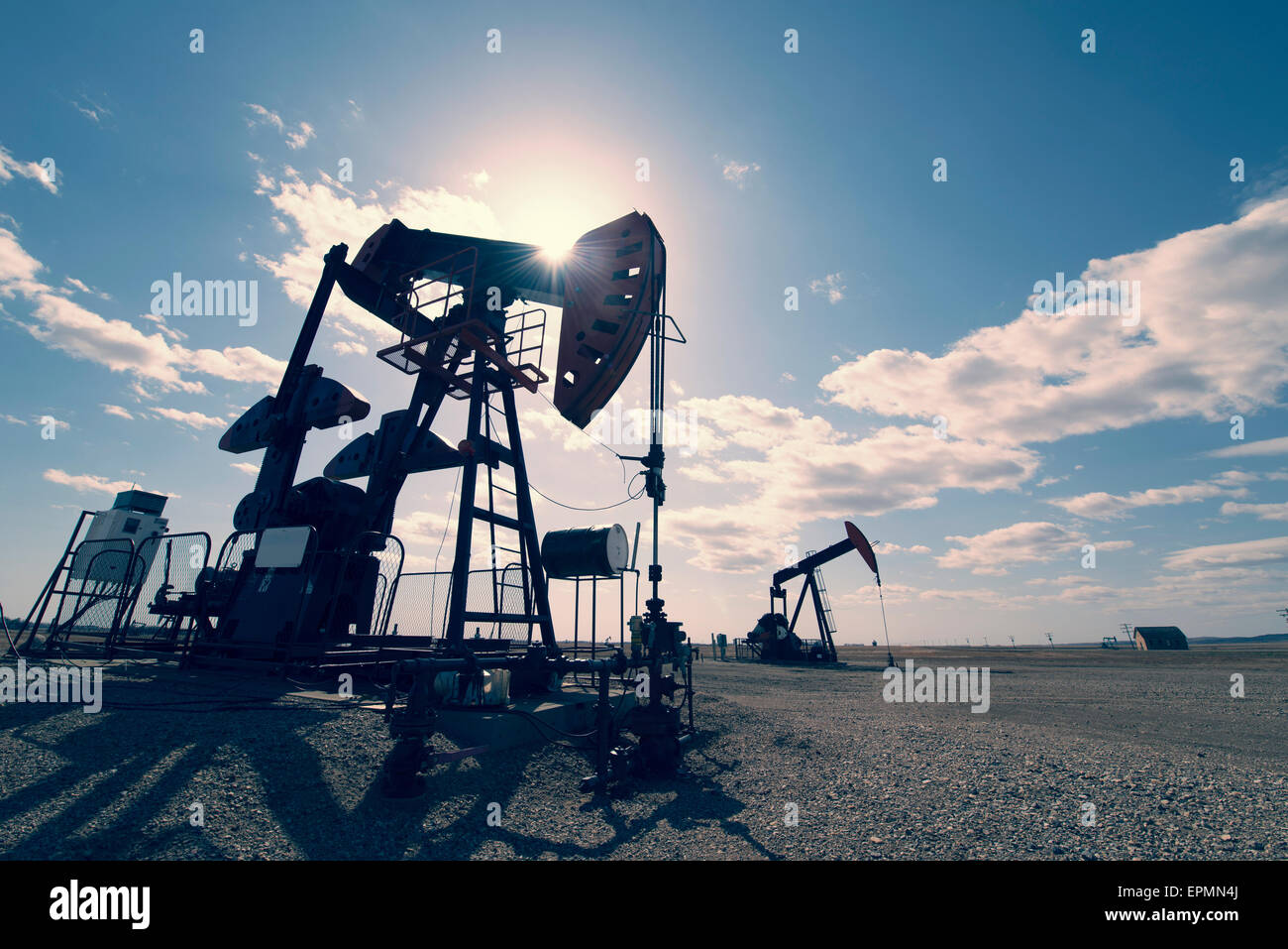 A pump jack in open ground at an oil extraction site Stock Photo - Alamy