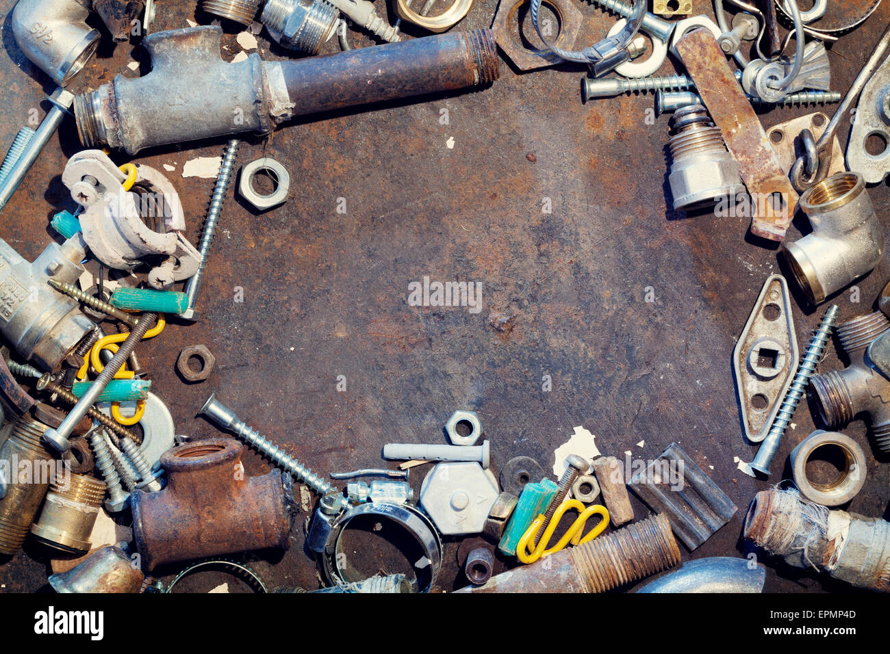 Workbench metal table with old water supply parts. Top view with copy ...