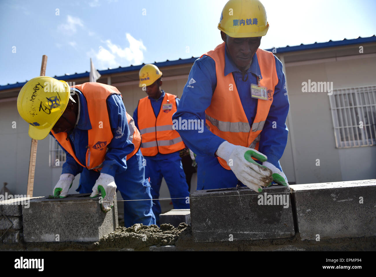 Nairobi, Kenya. 19th May, 2015. Local workers participate in a ...