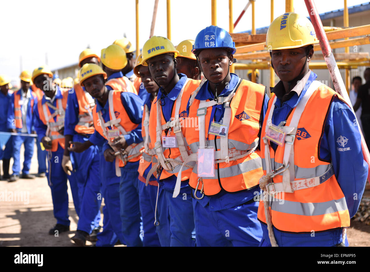 Nairobi, Kenya. 19th May, 2015. Local workers listen to the judge's ...