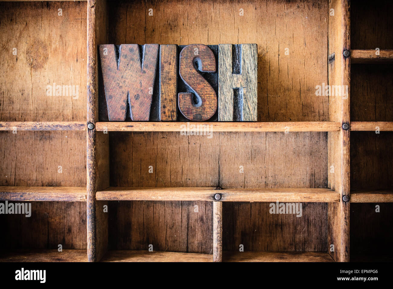 The word WISH written in vintage wooden letterpress type in a wooden ...