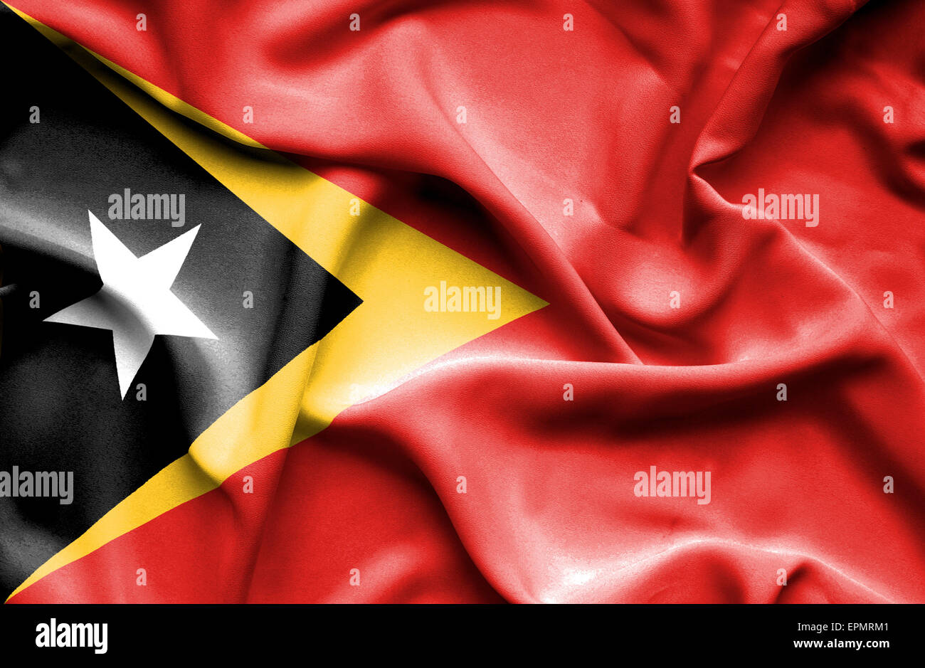 East Timor waving flag Stock Photo - Alamy