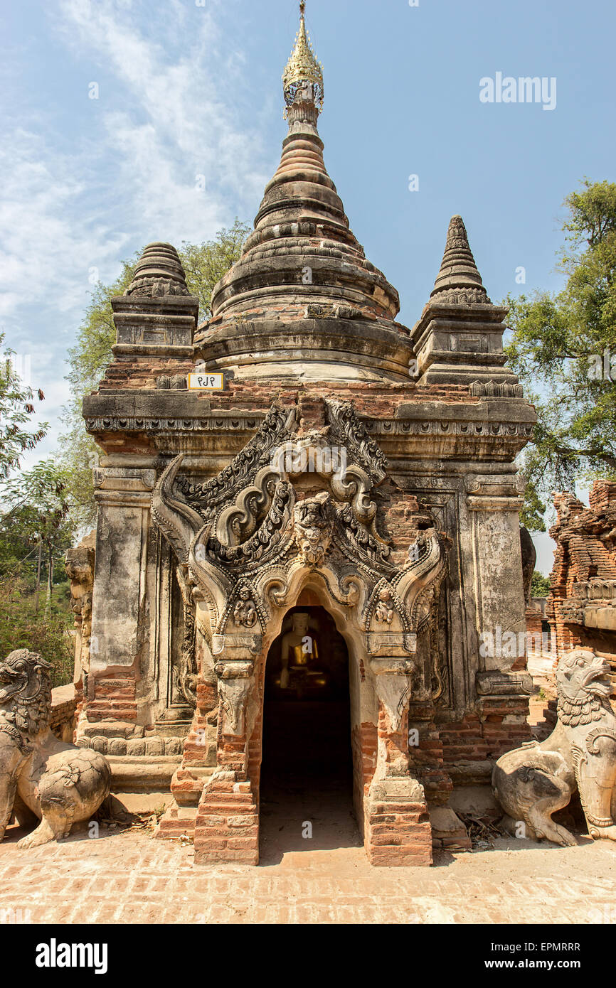 Buddhist shrine with a statue of Buddha inside Stock Photo - Alamy