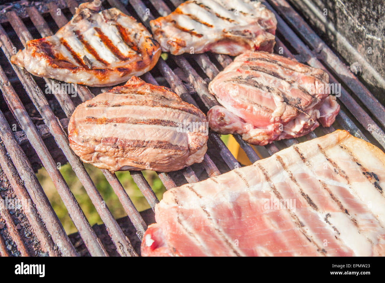 A lot of veal and pork meat, on a barbeque Stock Photo - Alamy