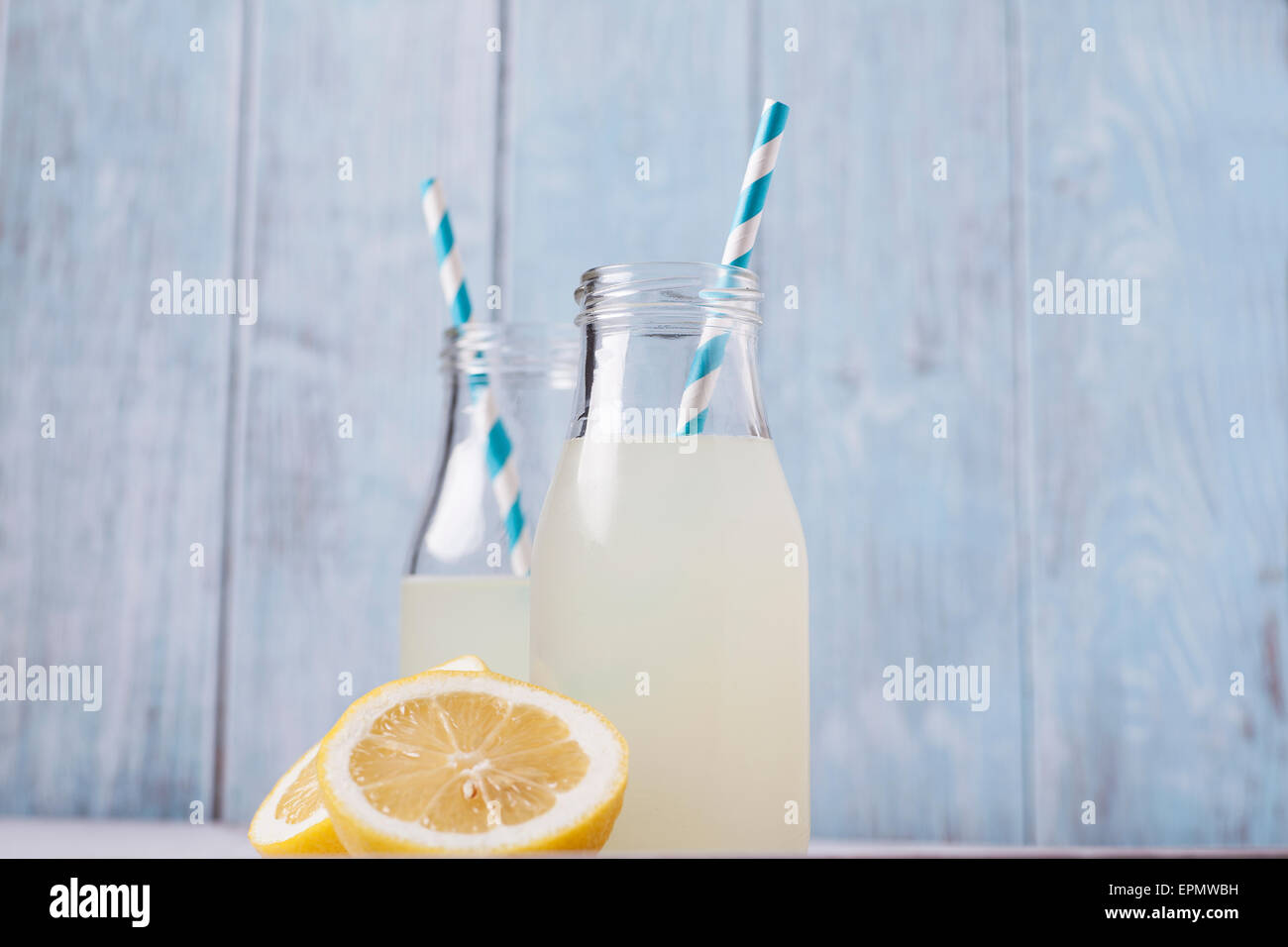 Traditional cloudy lemonade in glass bottles Stock Photo - Alamy