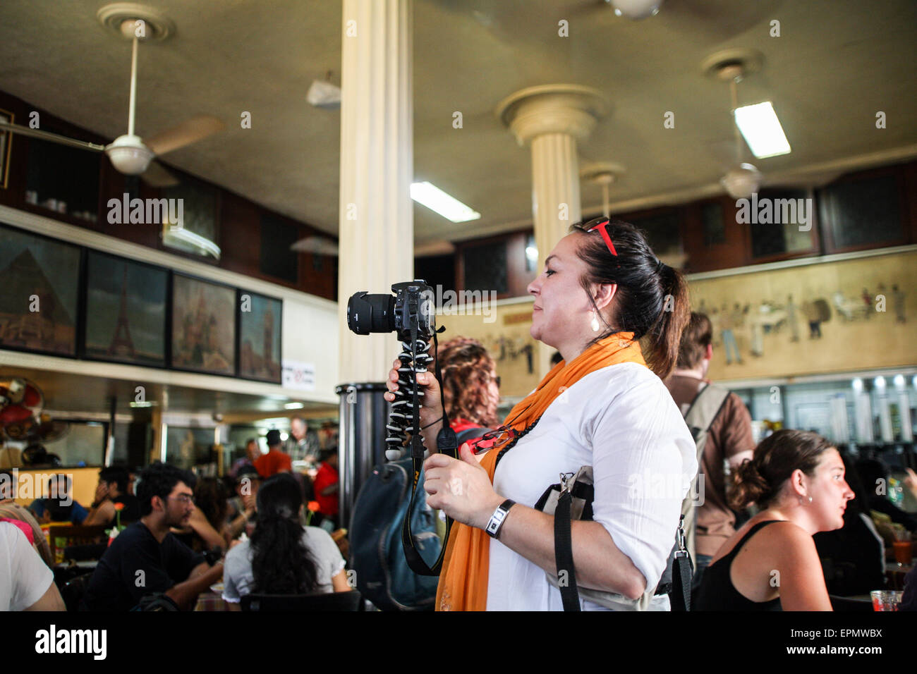 Tourist with camera photographing in Leopold Cafe, which was attacked ...