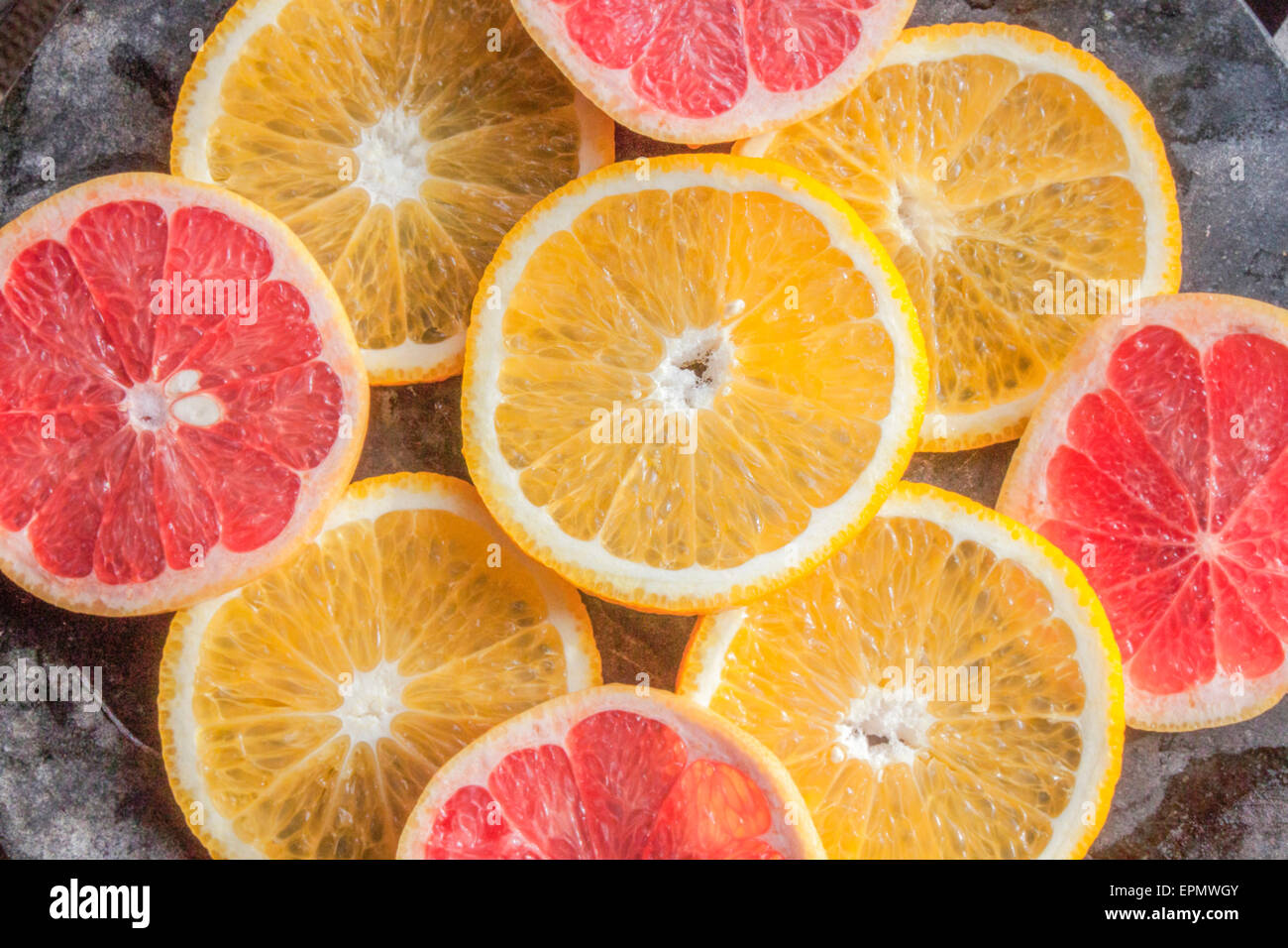 Yellow orange and blood red grape, on a stone plate Stock Photo - Alamy
