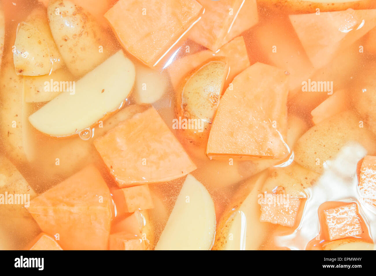 Potato and sweet potato cubes, boiling in water Stock Photo - Alamy