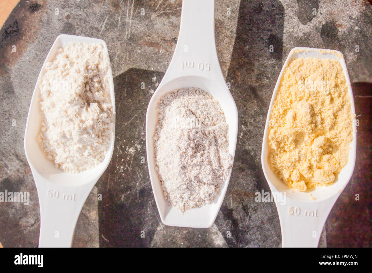 White wheat, yellow corn and grey rye flour, on spoons Stock Photo - Alamy