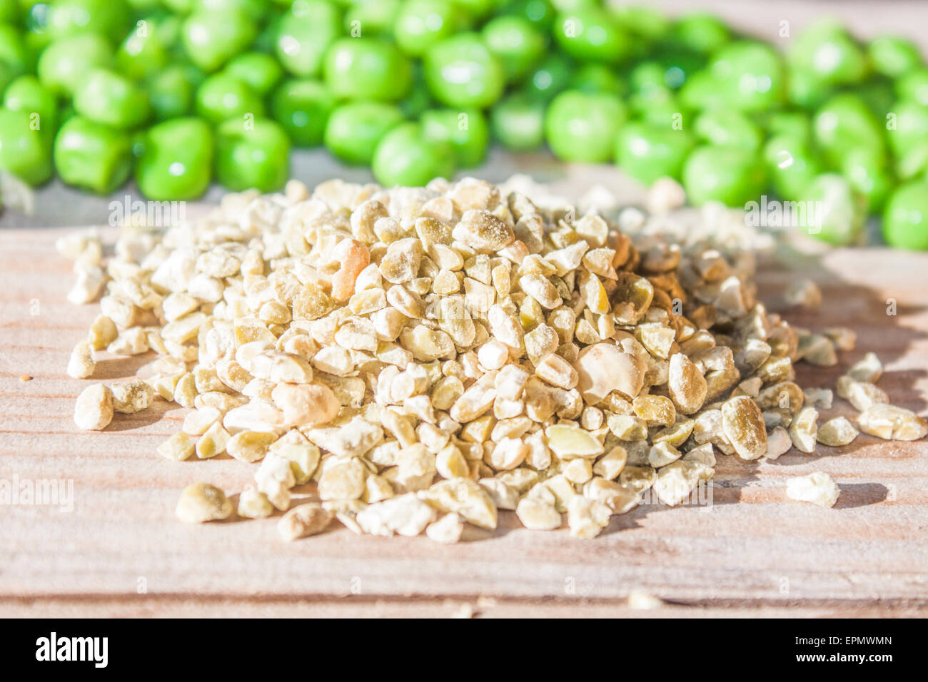 A pile of dried pea grains, in front of fresh peas Stock Photo - Alamy