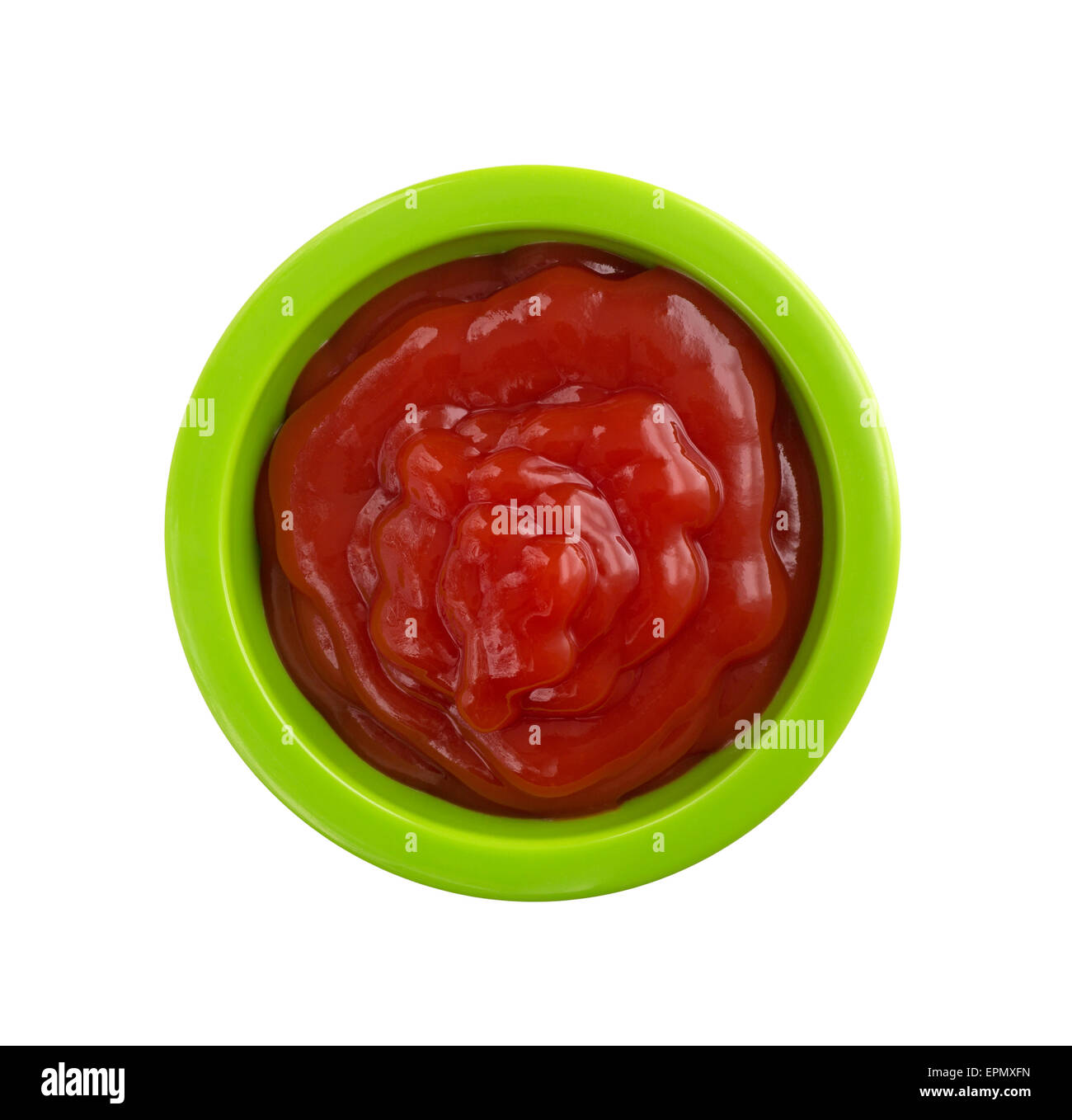 Top view of a small green portion bowl filled with ketchup isolated on ...