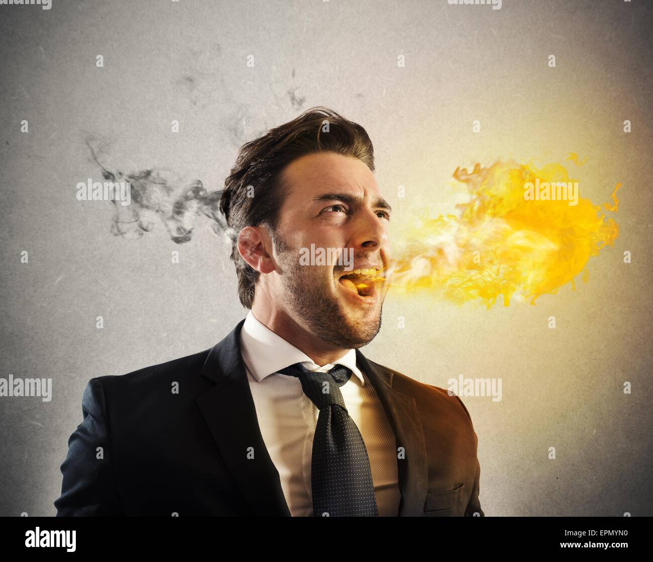 Furious businessman spitting fire Stock Photo - Alamy