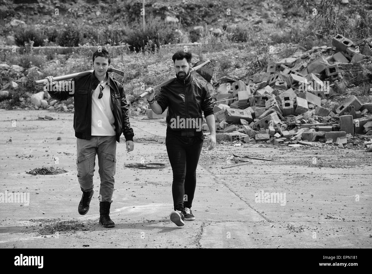 Cool guys walking with pickaxe and shovel Stock Photo - Alamy