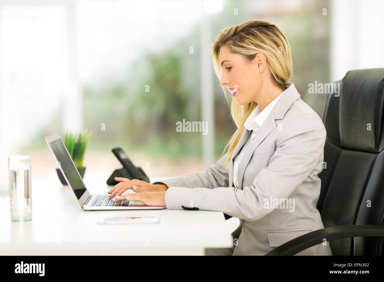professional businesswoman working on laptop computer Stock Photo - Alamy