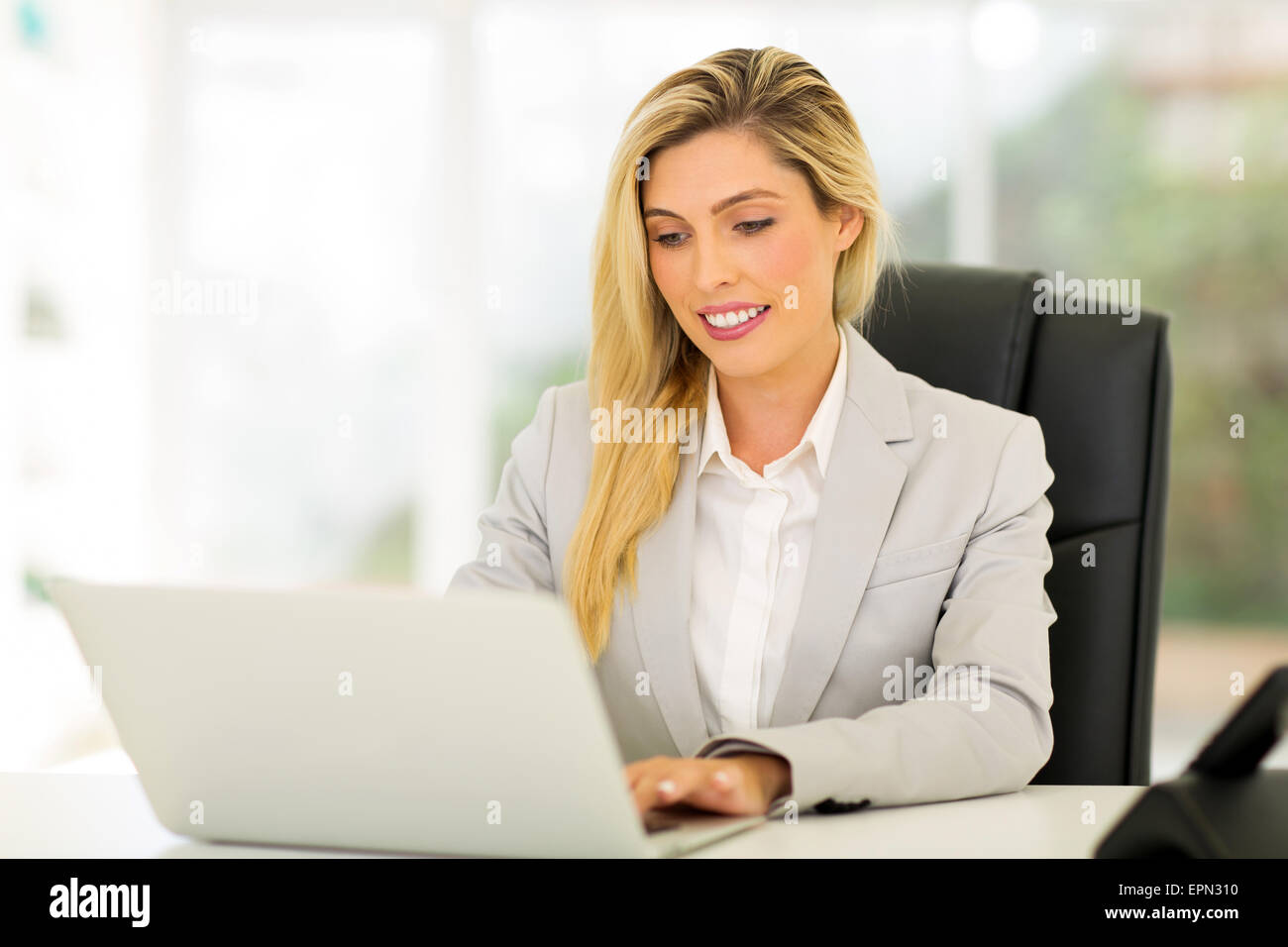 successful businesswoman using computer in office Stock Photo - Alamy