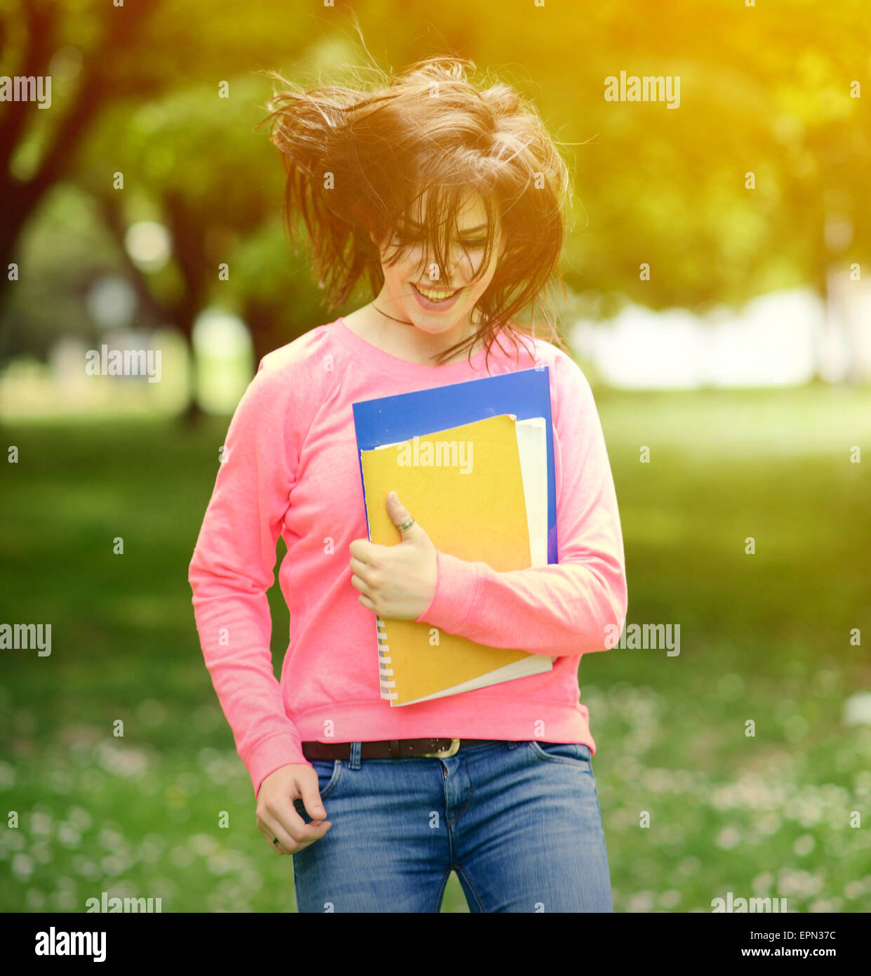 Happy student girl jumping for joy after passed exam Stock Photo - Alamy