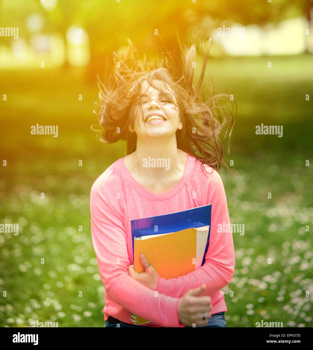 Happy student girl jumping for joy after passed exam Stock Photo - Alamy