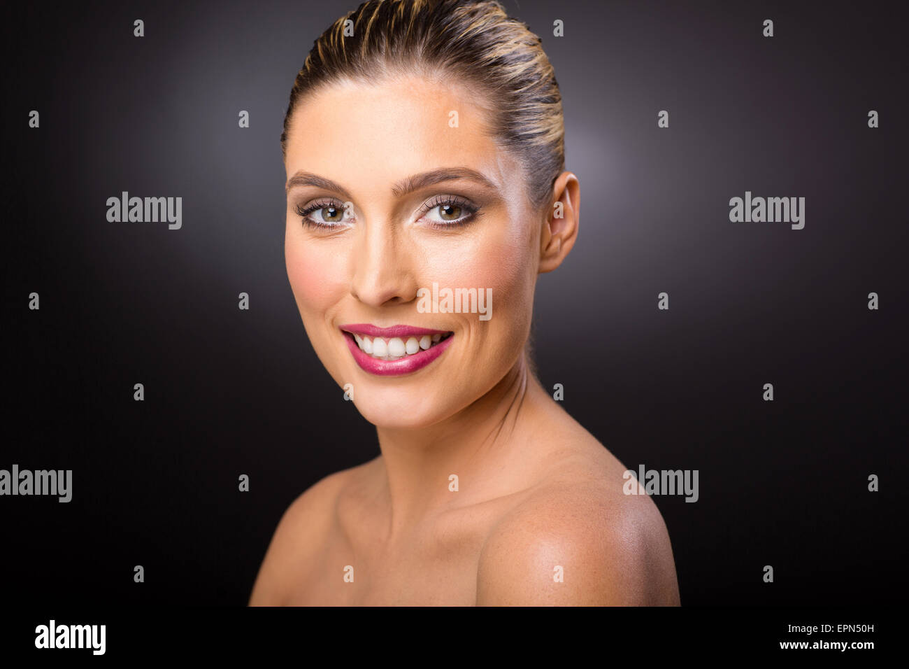 smiling female model looking at the camera Stock Photo - Alamy