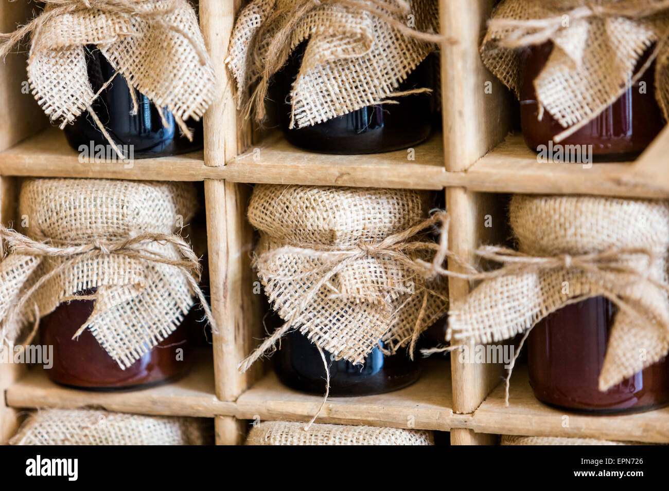 Vintage jams with burlap top in wood box Stock Photo - Alamy