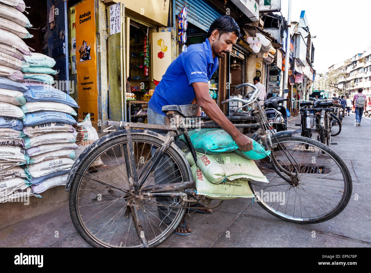 Indian man riding bicycle hi-res stock photography and images - Alamy