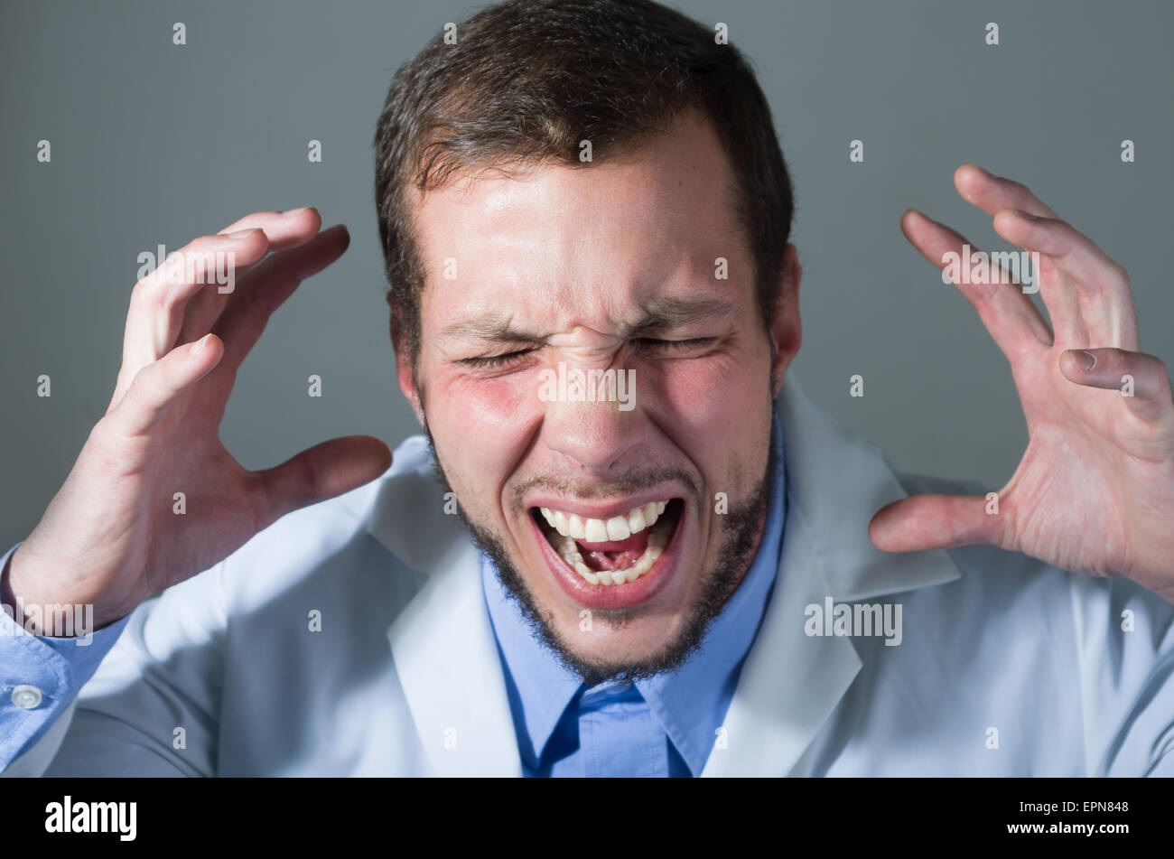 Closeup portrait of handsome young angry desperate doctor Stock Photo ...