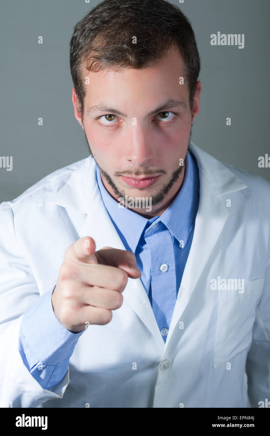 Closeup portrait of handsome young doctor giving a warning Stock Photo ...