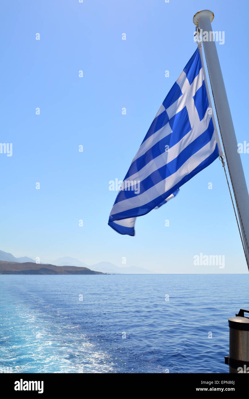 A Greek flag flying over the sea at the rear of a boat Stock Photo - Alamy