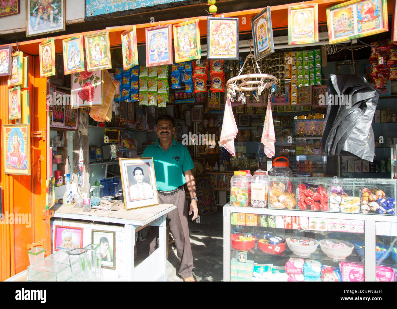 Indian shopkeeper smiling hi-res stock photography and images - Alamy
