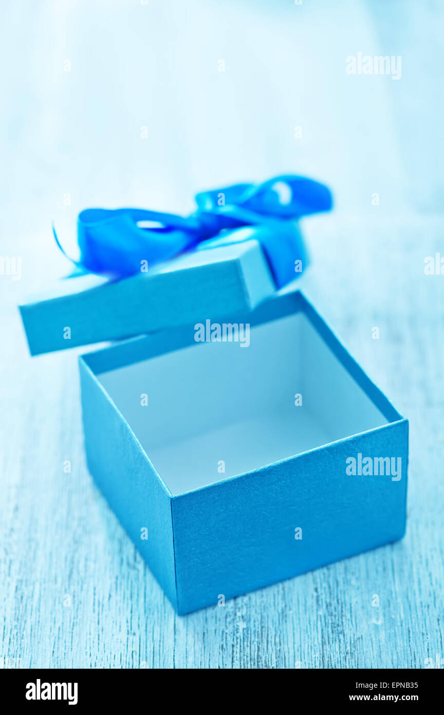 blue box for present on the wooden table Stock Photo - Alamy